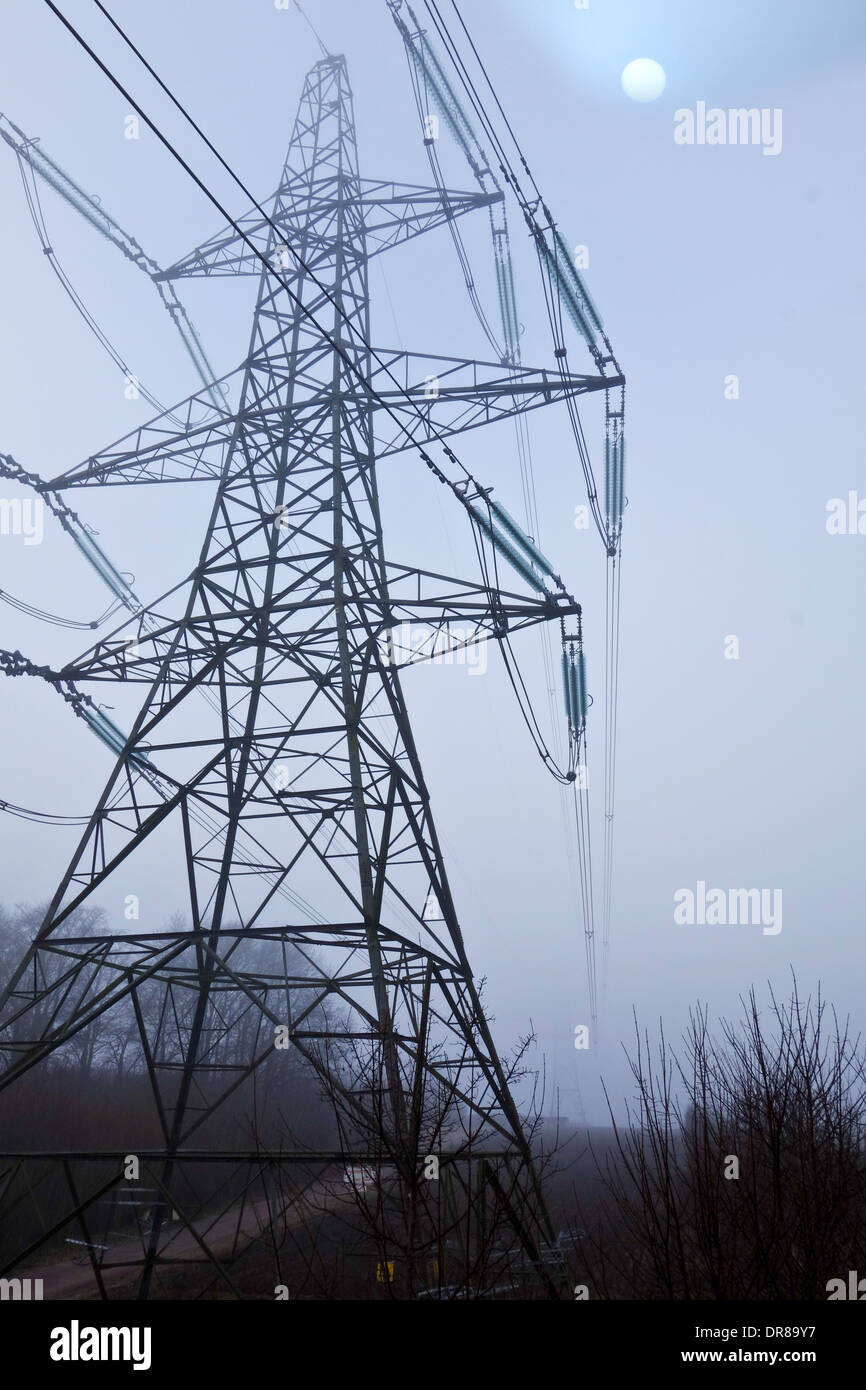 electricity pylon in the mist Stock Photo - Alamy