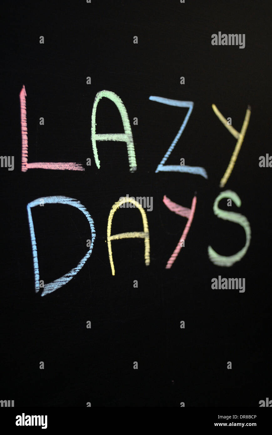 chalk writing - Lazy days. - words written on blackboard Stock Photo ...