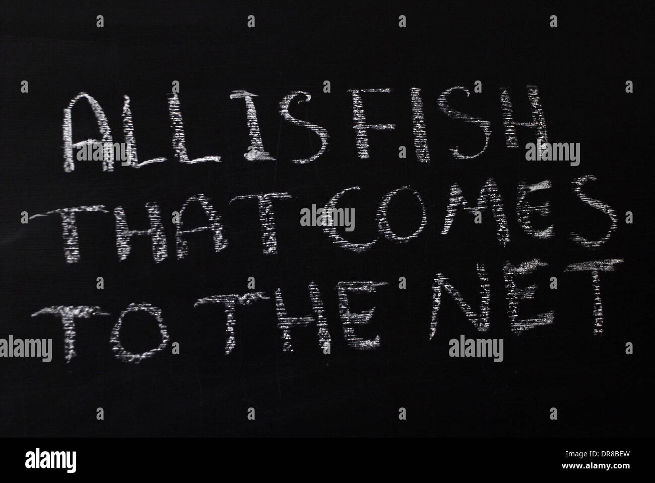 chalk writing - All is fish that comes to the net. - words written on ...