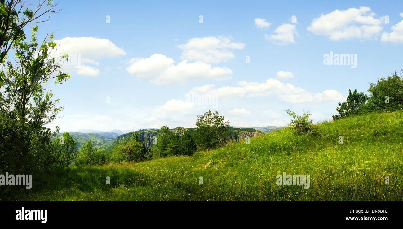 panoramic view of nice green hill on blue sky background Stock Photo ...