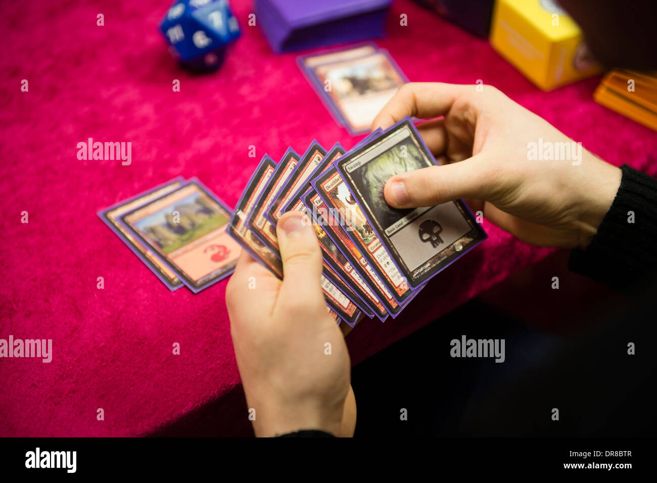 Men playing 'cardboard crack' - Magic the Gathering at a regular weekly ...