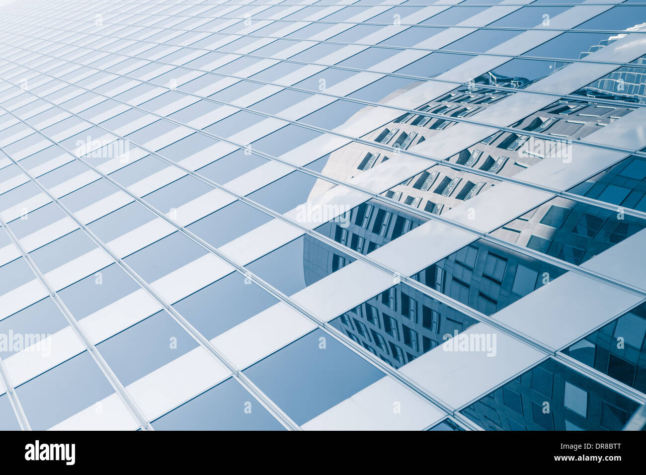 View of modern blue colored building made of glass Stock Photo - Alamy
