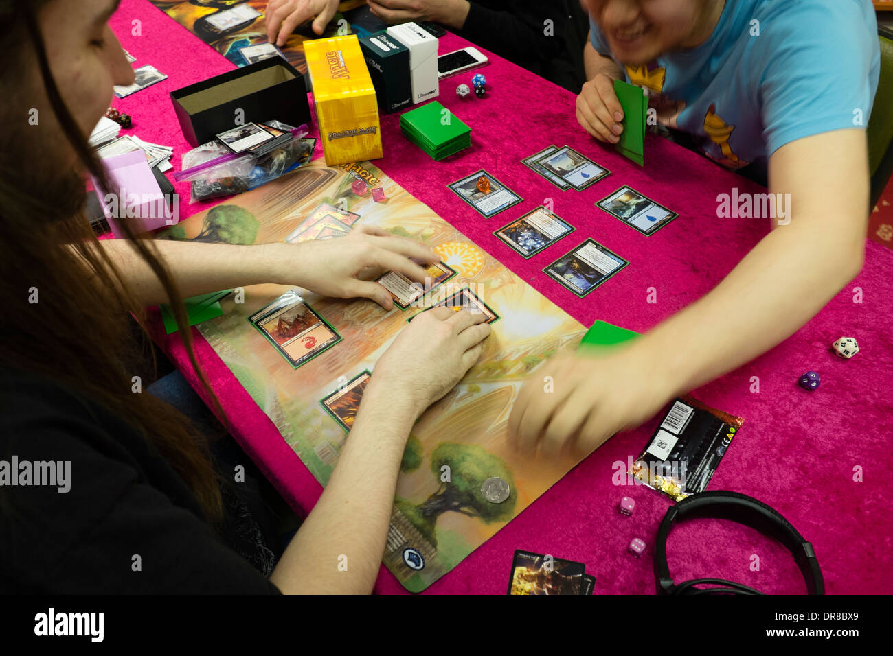 A group of men playing 'cardboard crack' - Magic the Gathering at a ...
