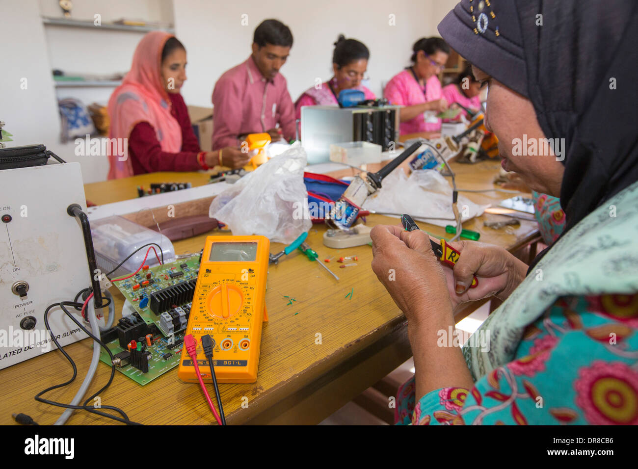 Women on a solar workshop, learning how to make solar lanters at the ...
