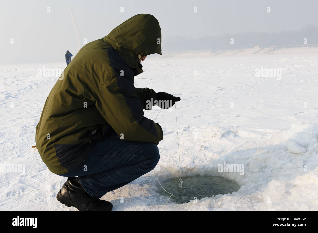Ice hole fish hi-res stock photography and images - Alamy