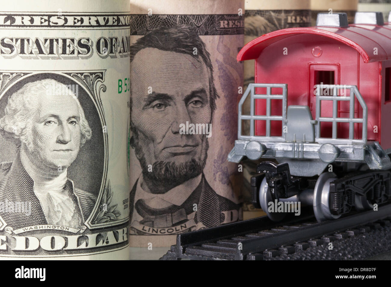 Red railway wagon and U.S. dollar banknotes Stock Photo - Alamy