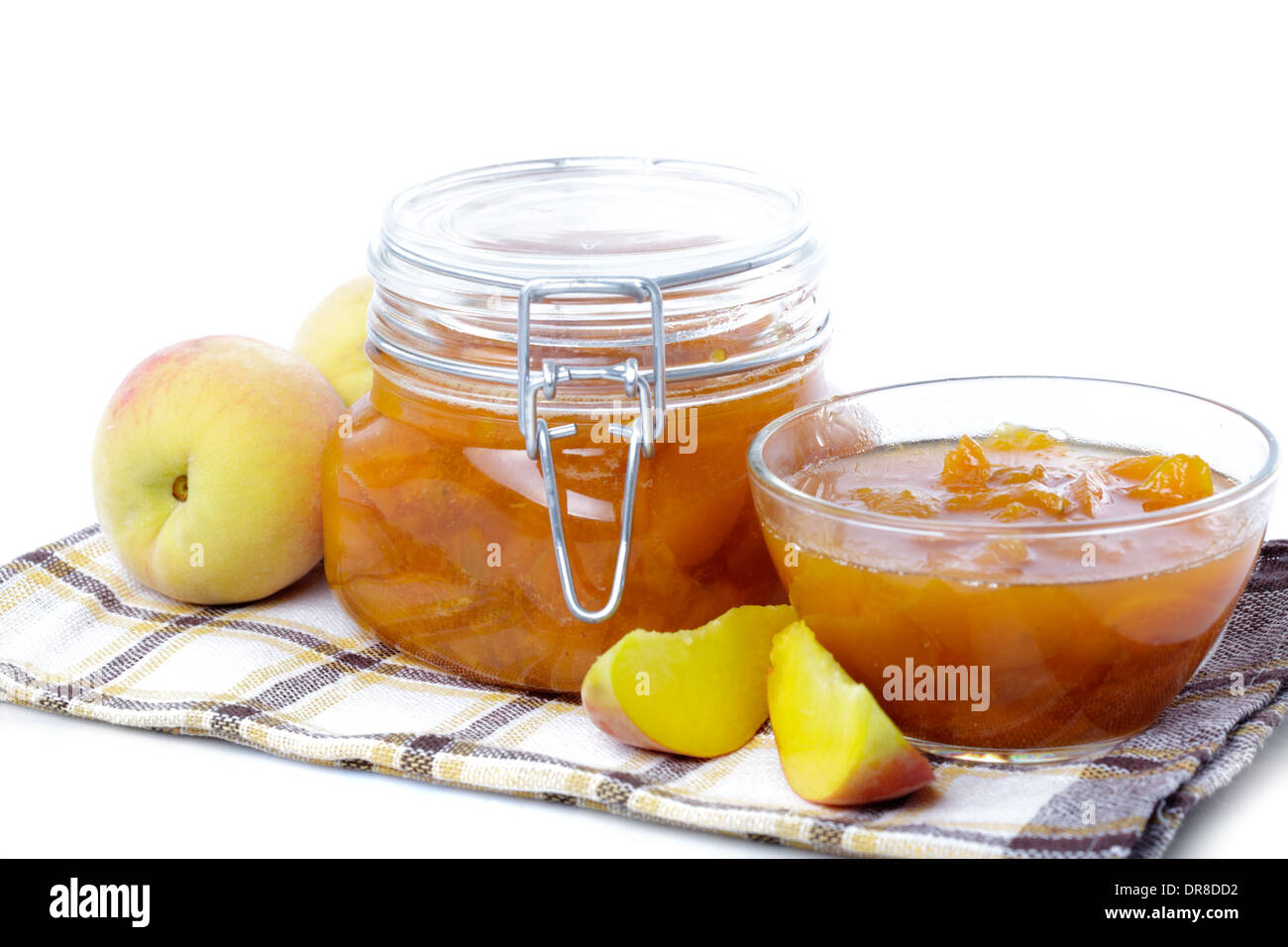 Peach jam with fresh fruits isolated on white Stock Photo - Alamy