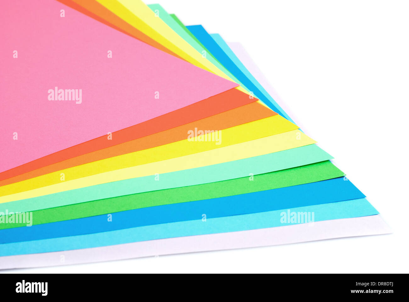 various color paper stacks isolated on white Stock Photo - Alamy