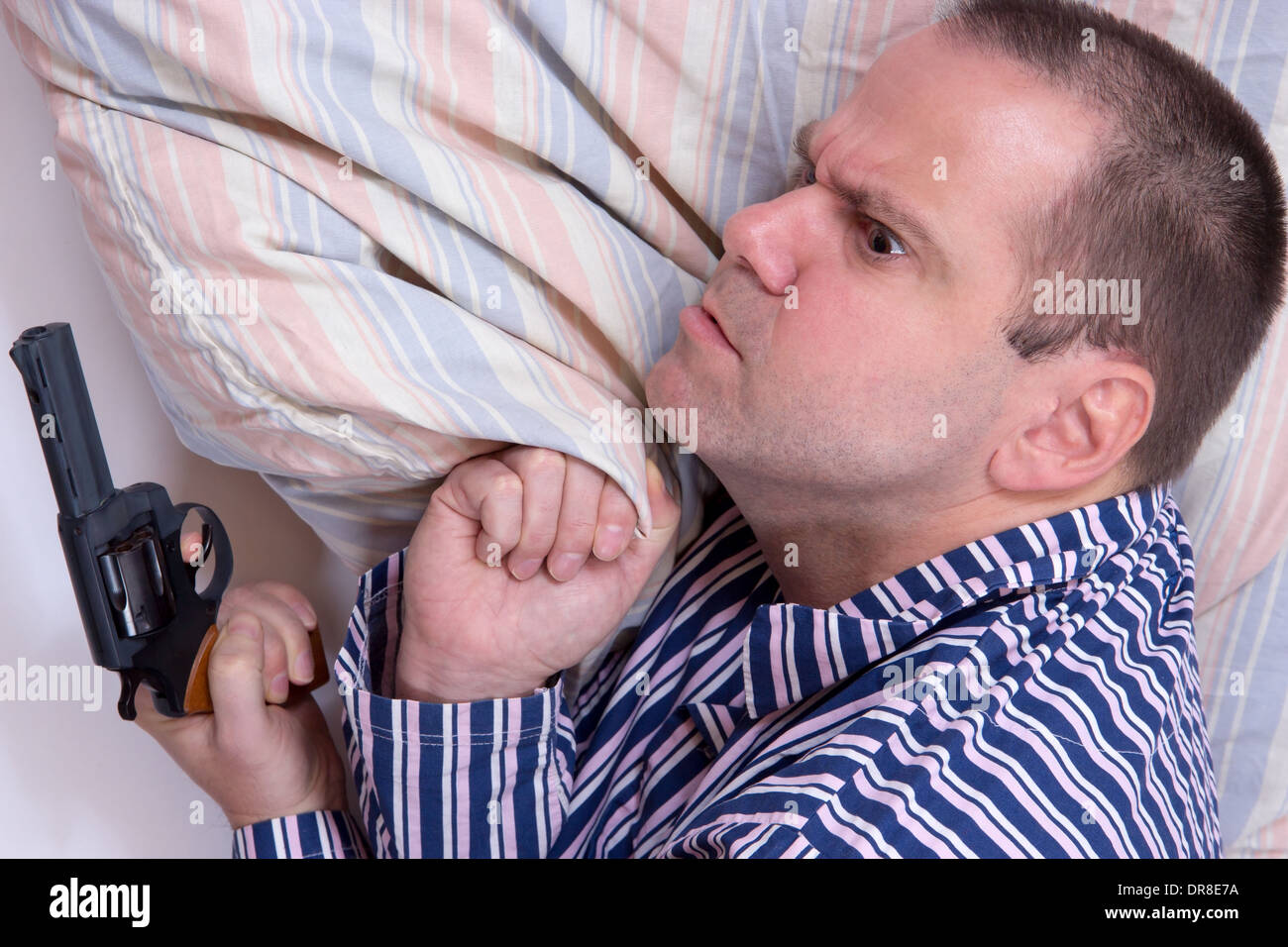 Pistol an bed hi-res stock photography and images - Alamy
