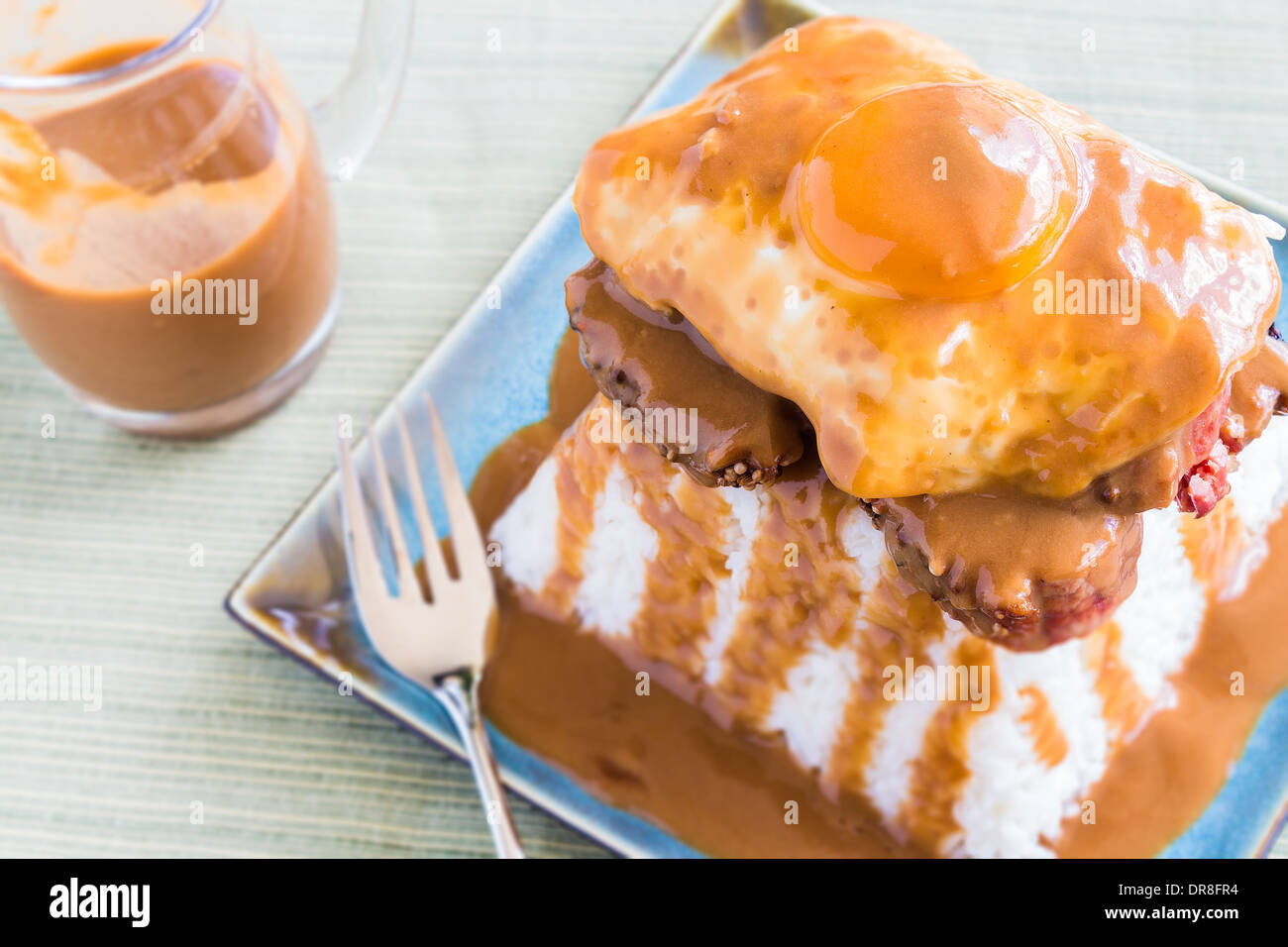 Loco Moco, a traditional Hawaiian food, made by stacking brisket on top ...