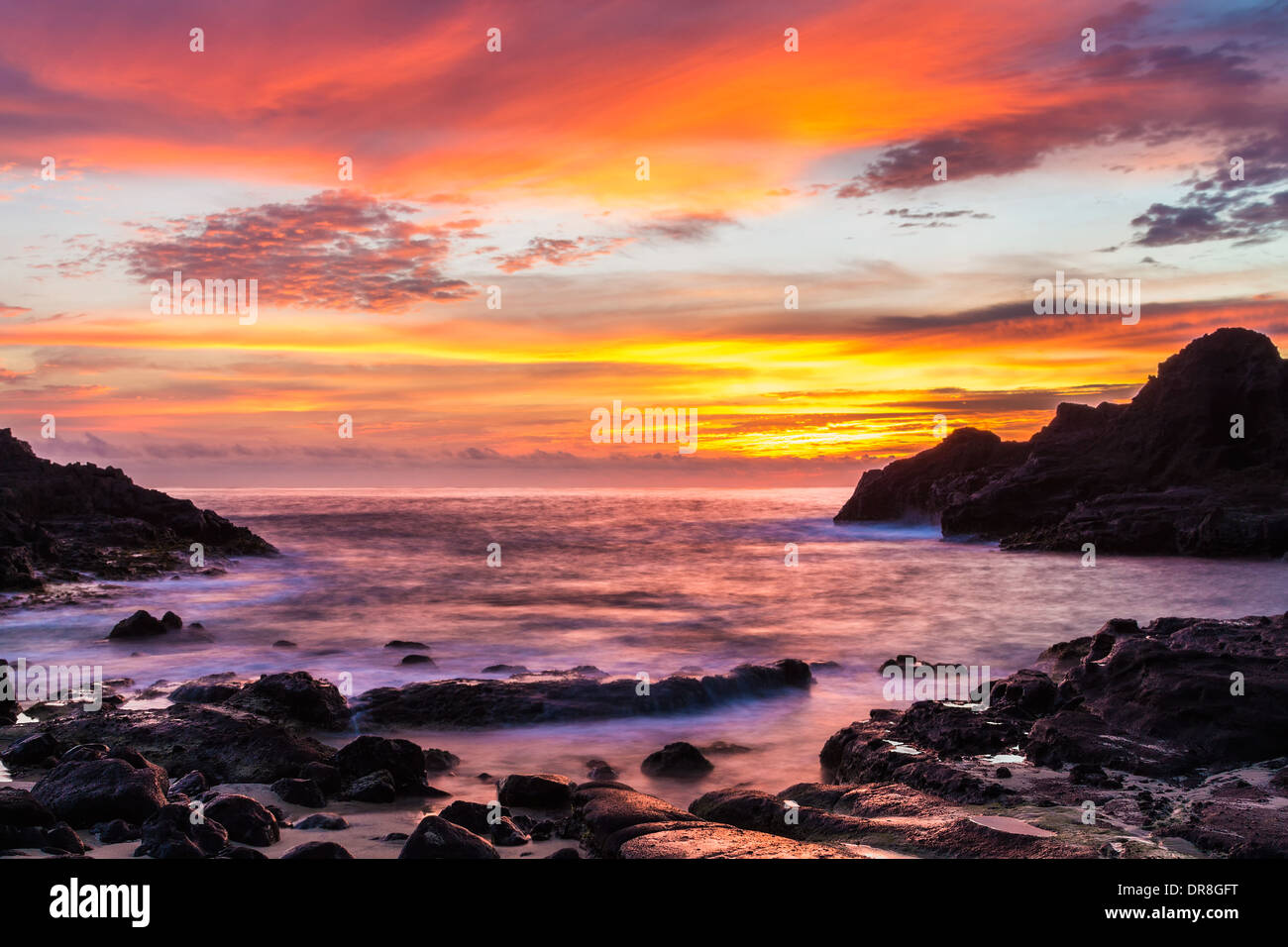 Intensely colorful sunrise at Halona Cove, commonly known as Eternity ...