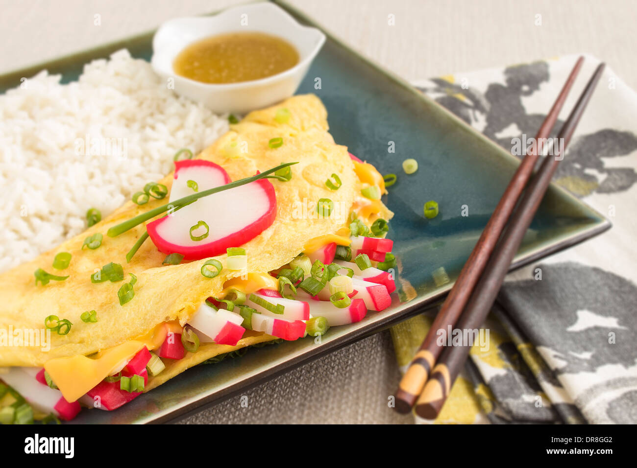 Omelet stuffed with strips of kamaboko, a japanese white fish cake ...