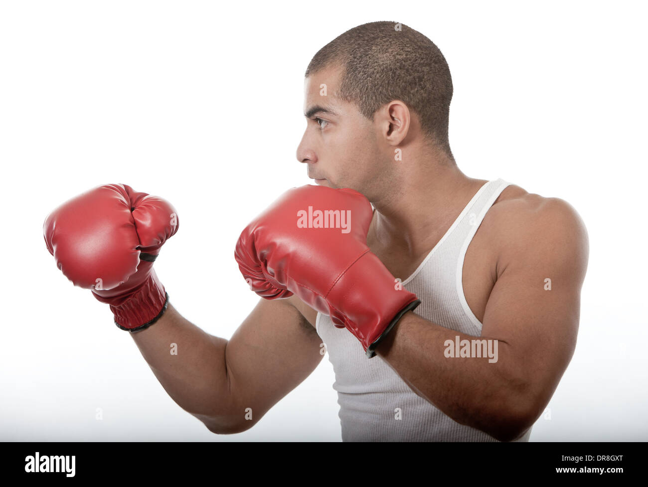 Attractive young man kickboxing Stock Photo - Alamy