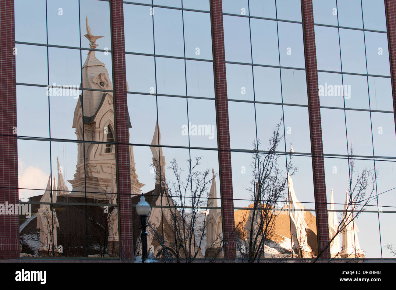 The Assembly Hall in Temple Square is reflected in modern buildings in ...