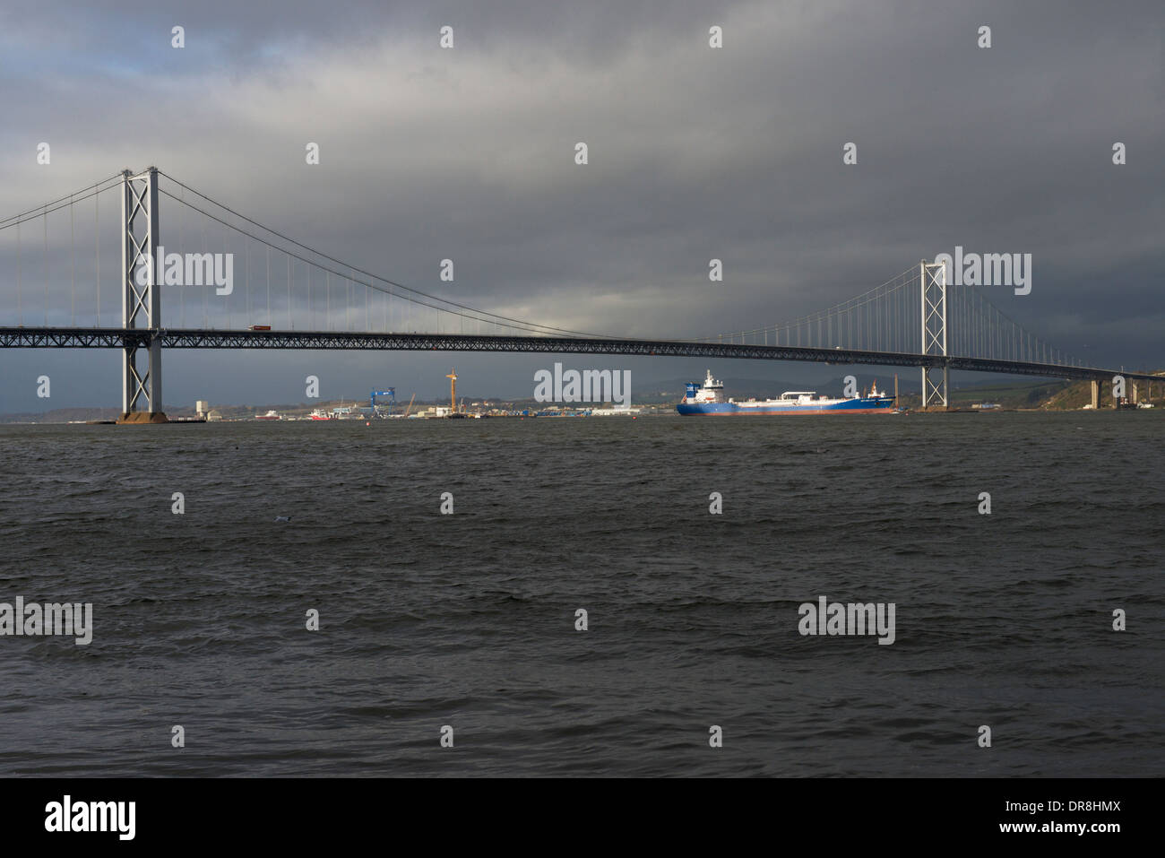 Forth Road Bridge with the Bit Okland oil tanker passing below Stock ...