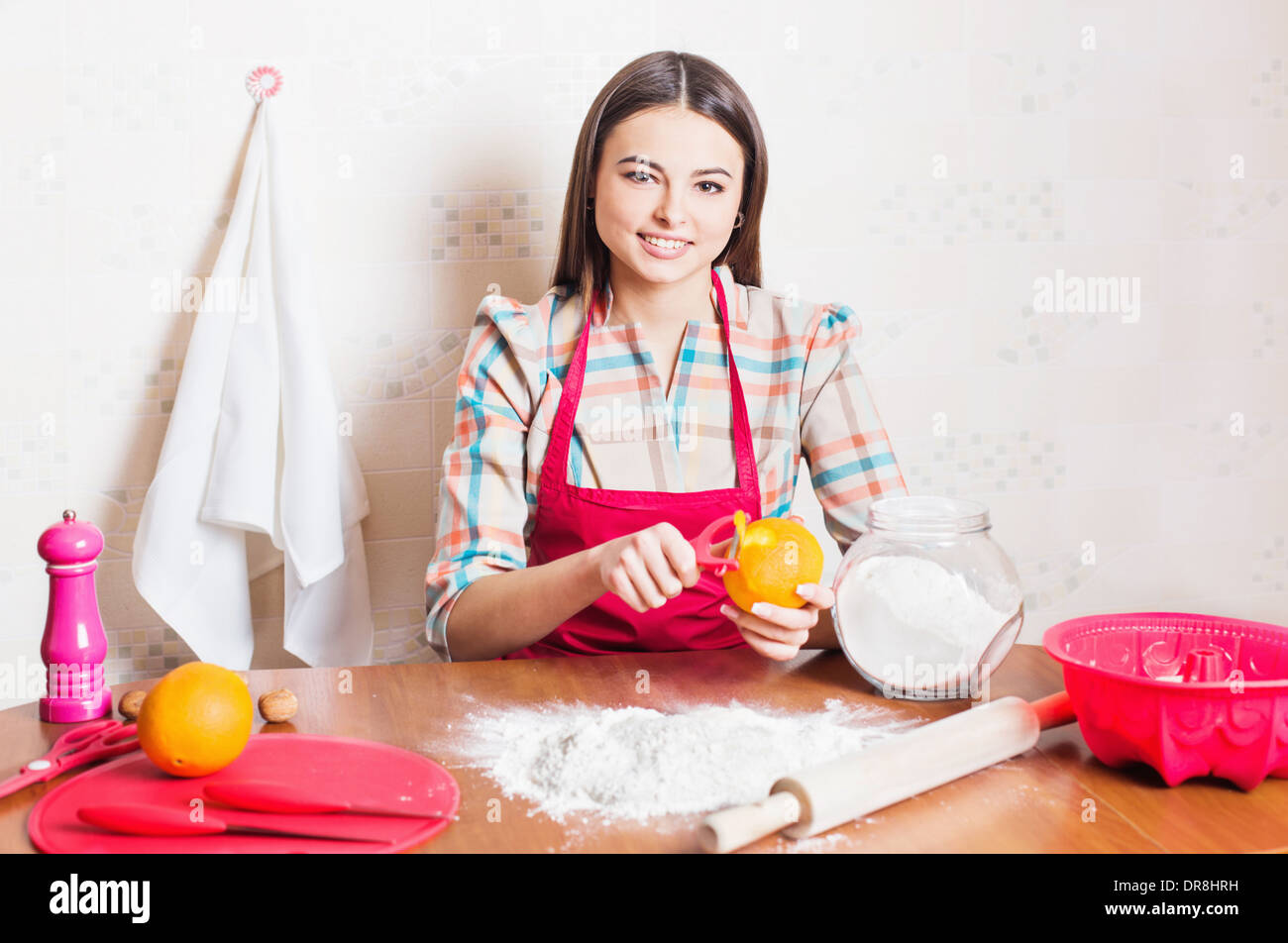 beautiful girl cooking cake in kitchen Stock Photo - Alamy