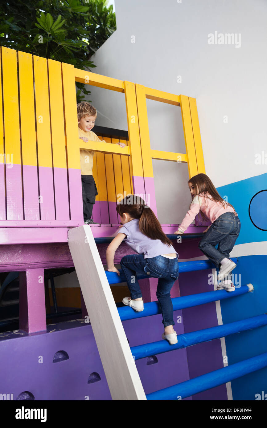 Girls Climbing Playhouse Ladder Stock Photo - Alamy