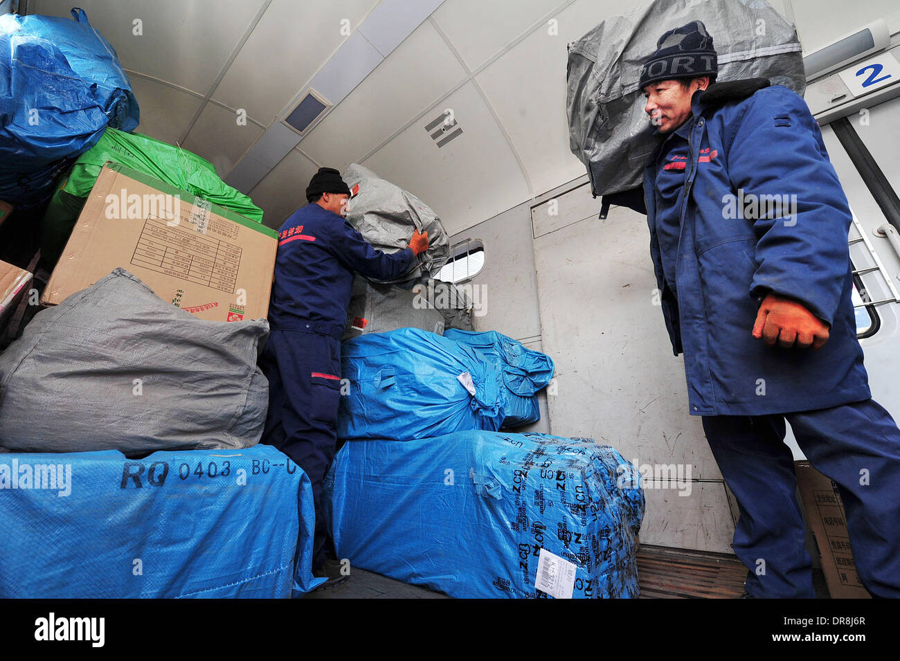 Yinchuan, China. 20th Jan, 2014. Logistic workers of China Railway ...