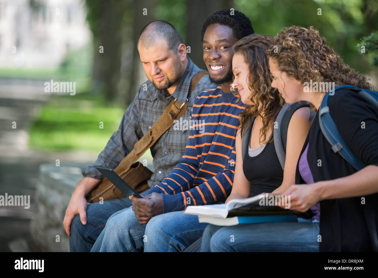 University Student Sitting With Friends On Campus Stock Photo - Alamy