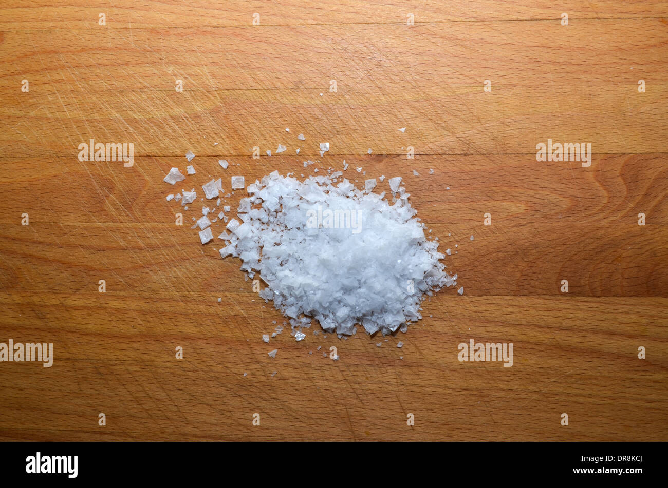 Salt pile on a wooden surface Stock Photo - Alamy