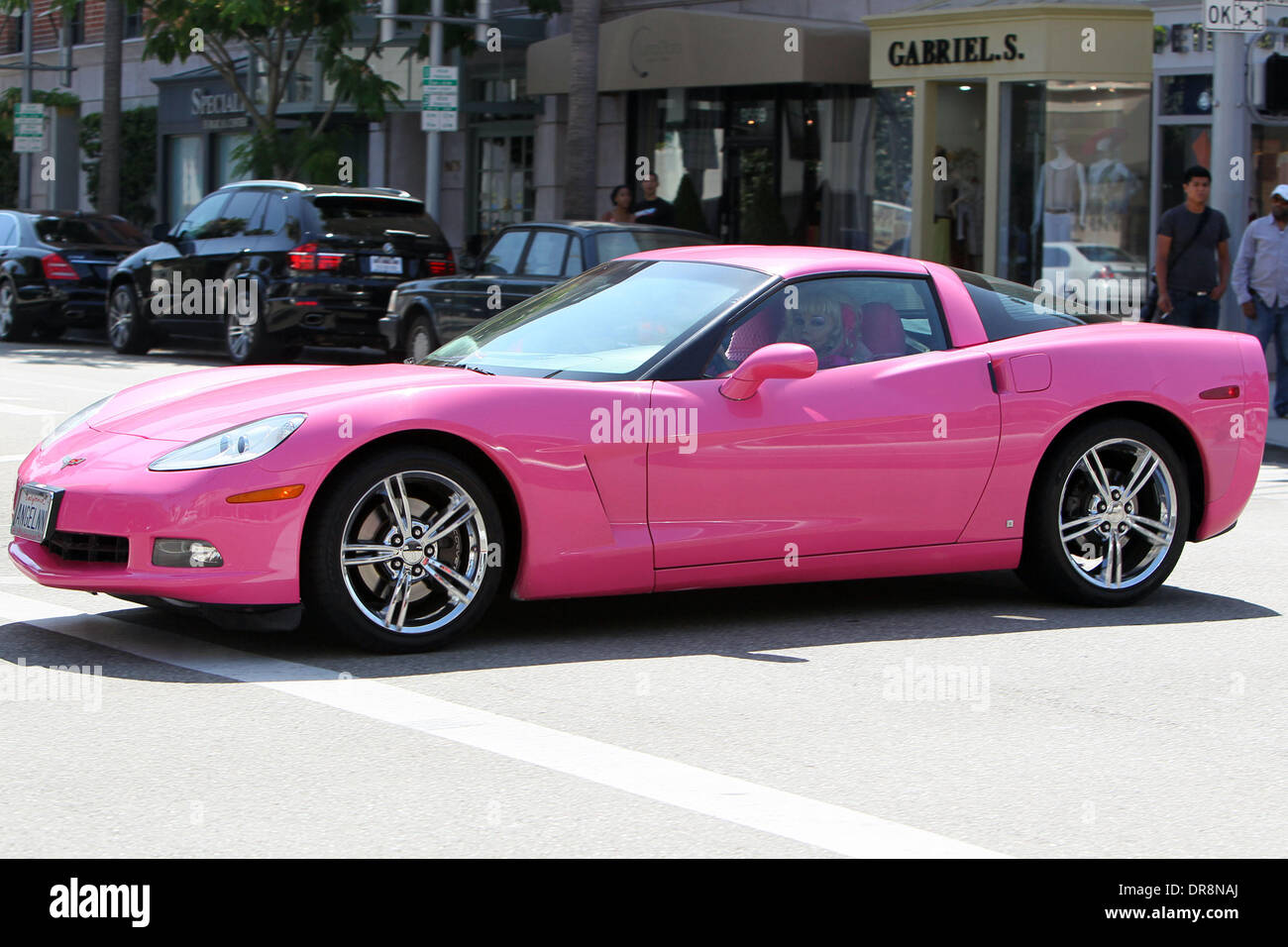 Los Angeles icon, Angelyne drives down the street in Beverly Hills in ...