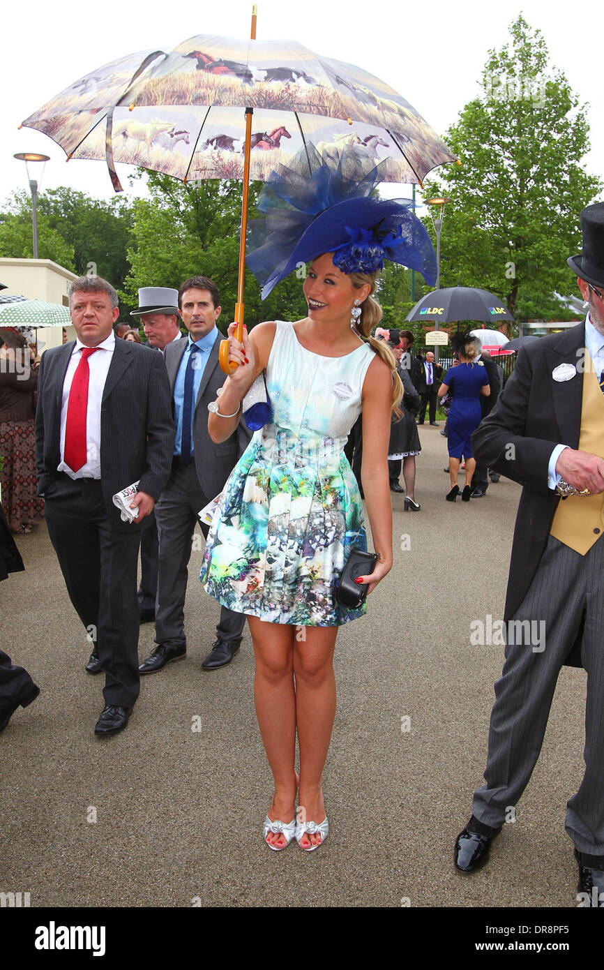 Racegoers brave the wet weather during Royal Ascot at Ascot Racecourse ...