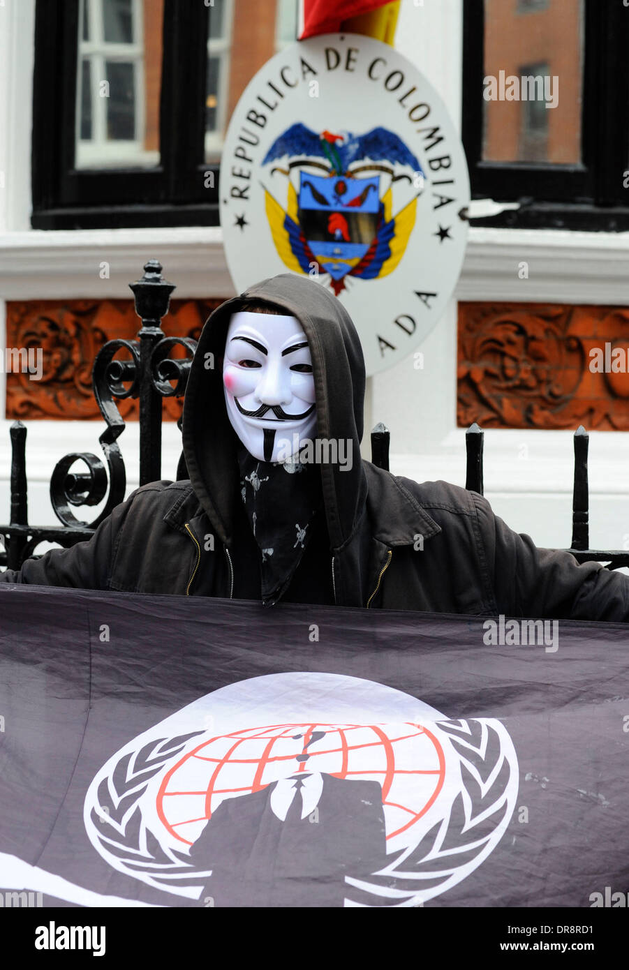 A lone member of the hacktivist group known as 'Anonymous' poses ...
