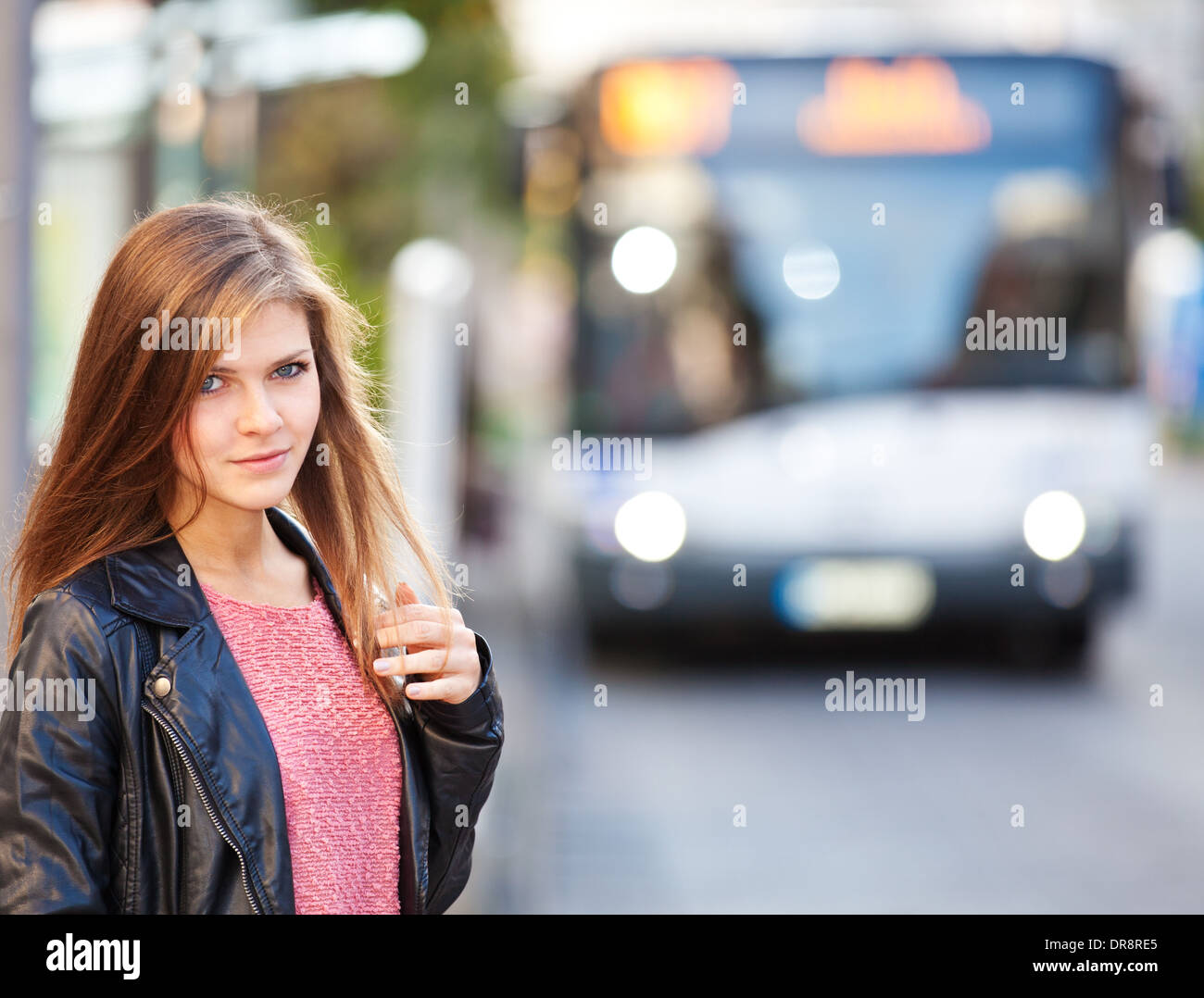 Attractive teenage girl at the bus stop Stock Photo - Alamy