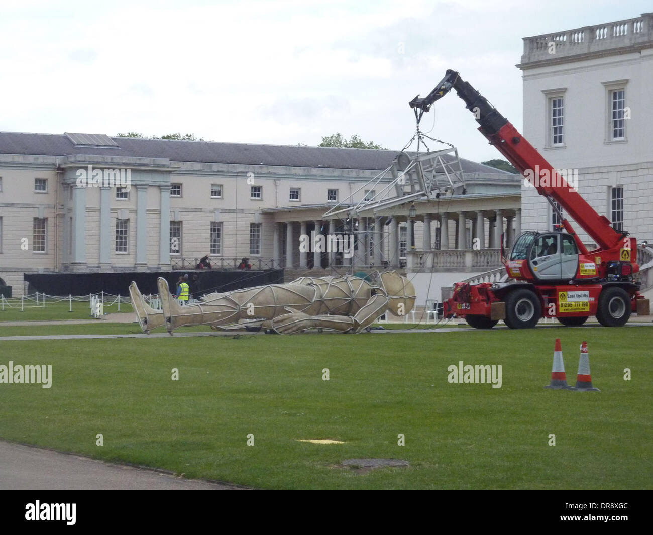 Workers prepare an installation before the performance of 'Prometheus ...