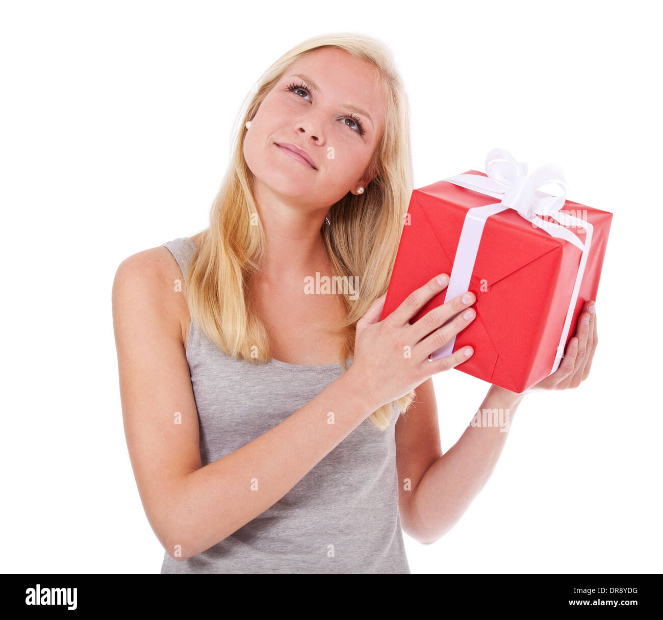 Attractive young woman holding present. All on white background Stock ...