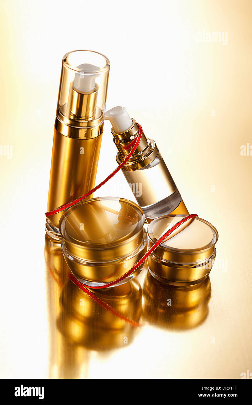 golden make up set in gold background Stock Photo - Alamy