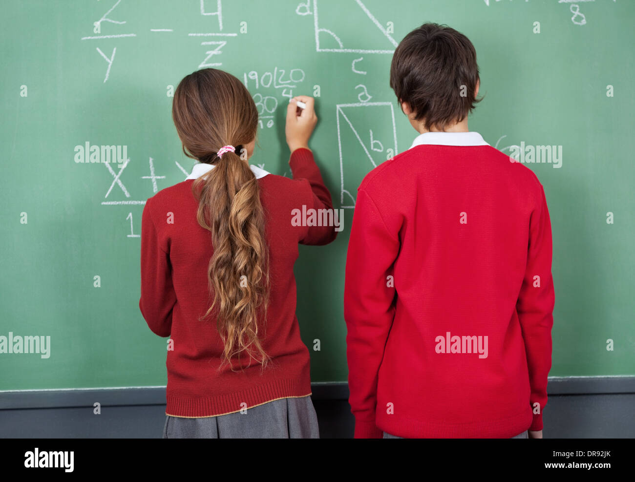 Students at blackboard Stock Photo - Alamy