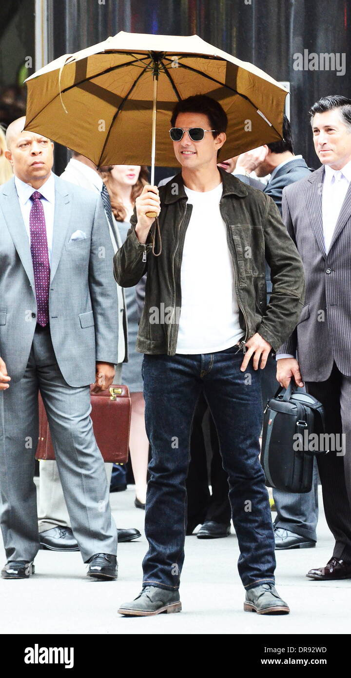 Tom Cruise gets caught in the rain while filming on the set of ...