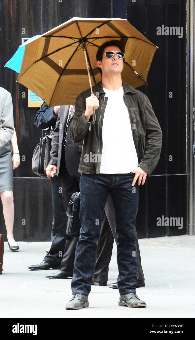 Tom Cruise gets caught in the rain while filming on the set of ...