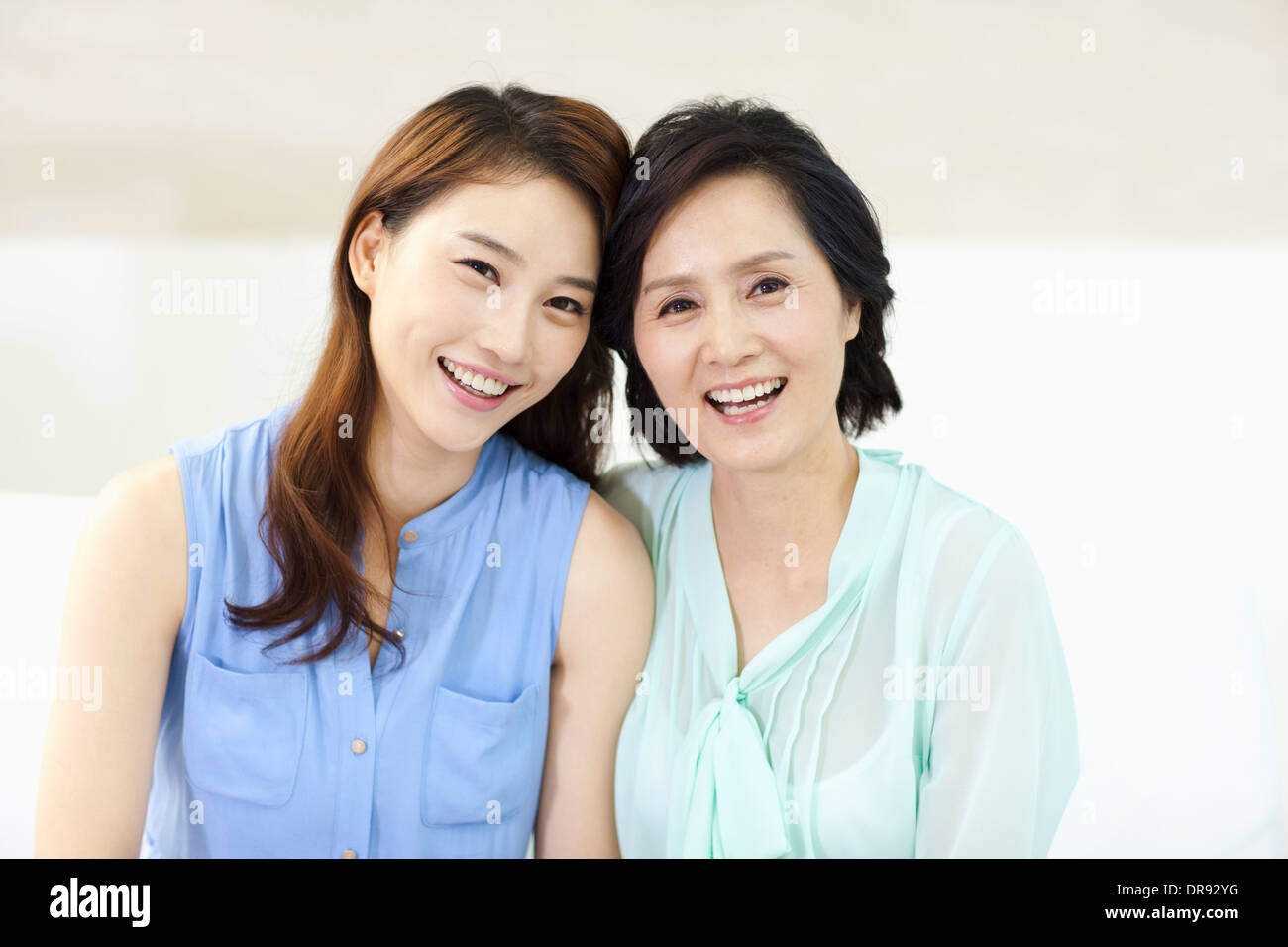 mother and grown up daughter smiling together Stock Photo - Alamy
