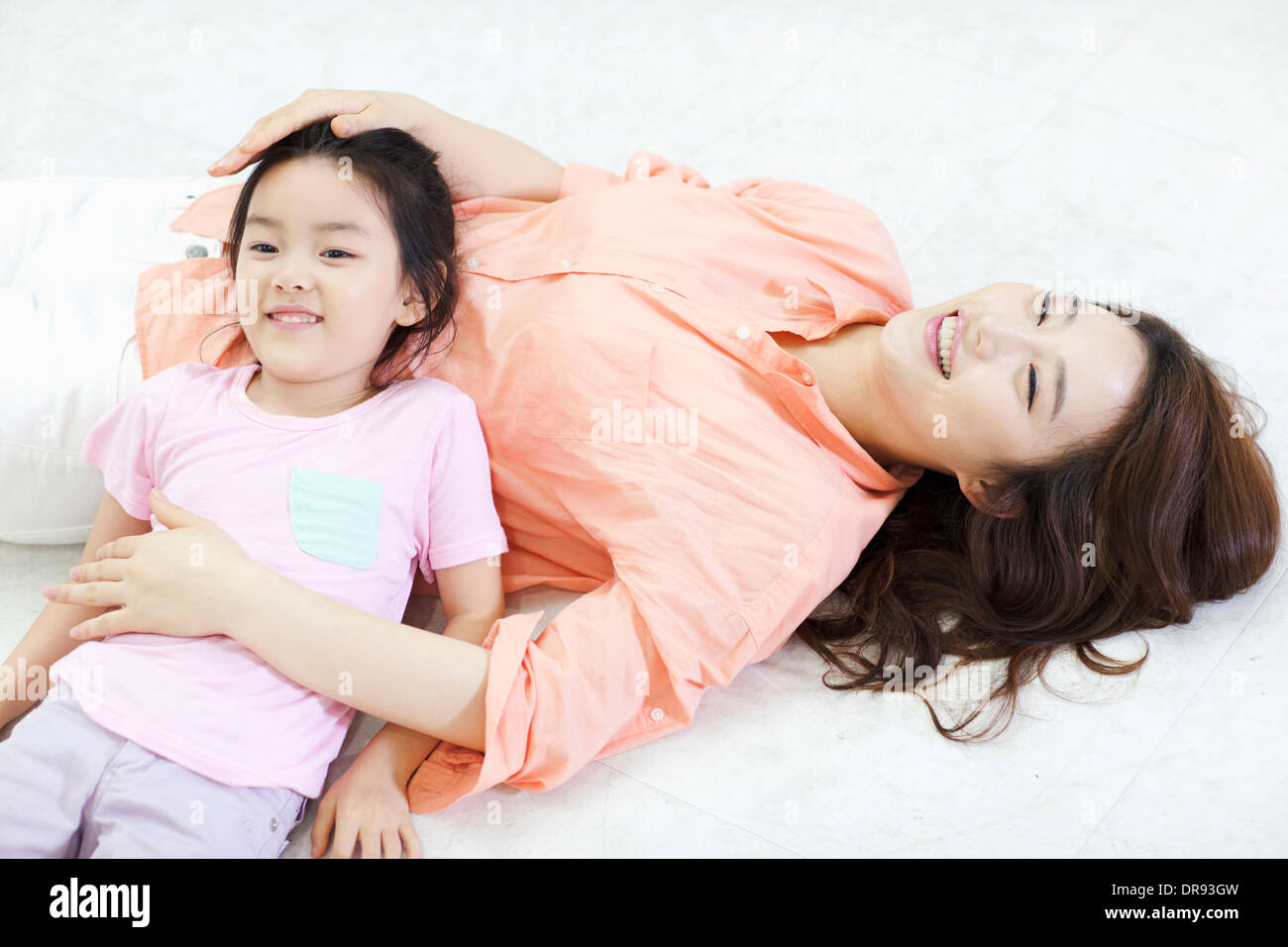 Daughter lying on her mother hi-res stock photography and images - Alamy
