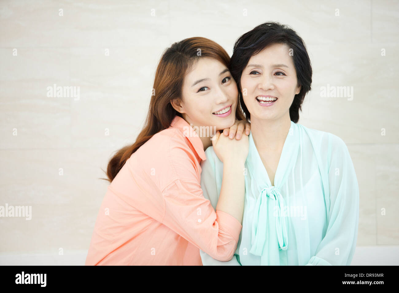 a mother hugging with grown up daughter Stock Photo - Alamy