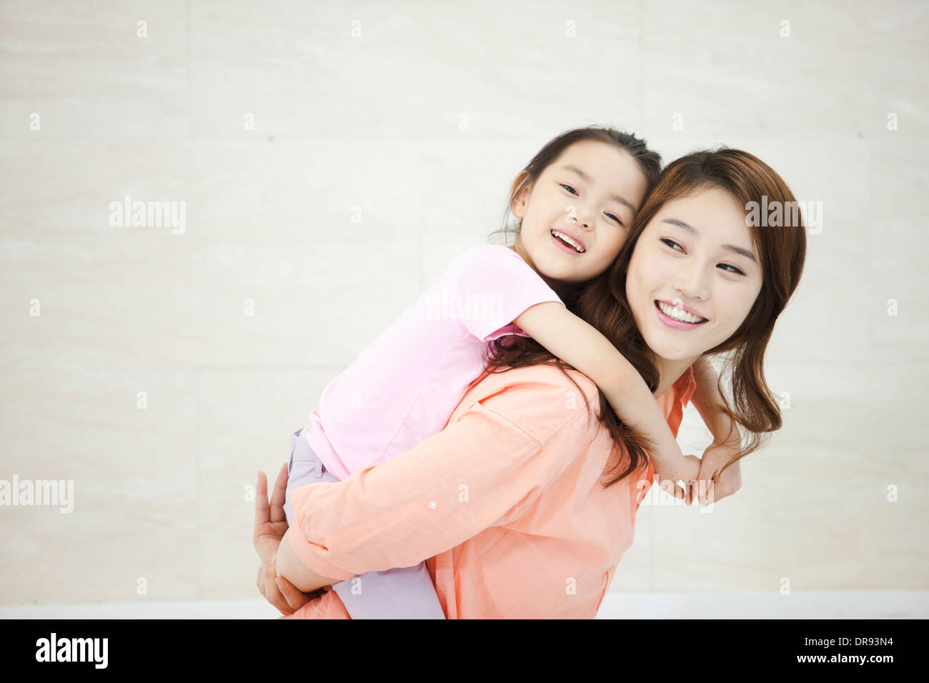 a kid hugging mother Stock Photo - Alamy