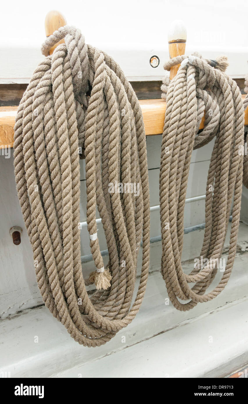 Tightropes tied around wooden peg in a sailing ship Stock Photo - Alamy