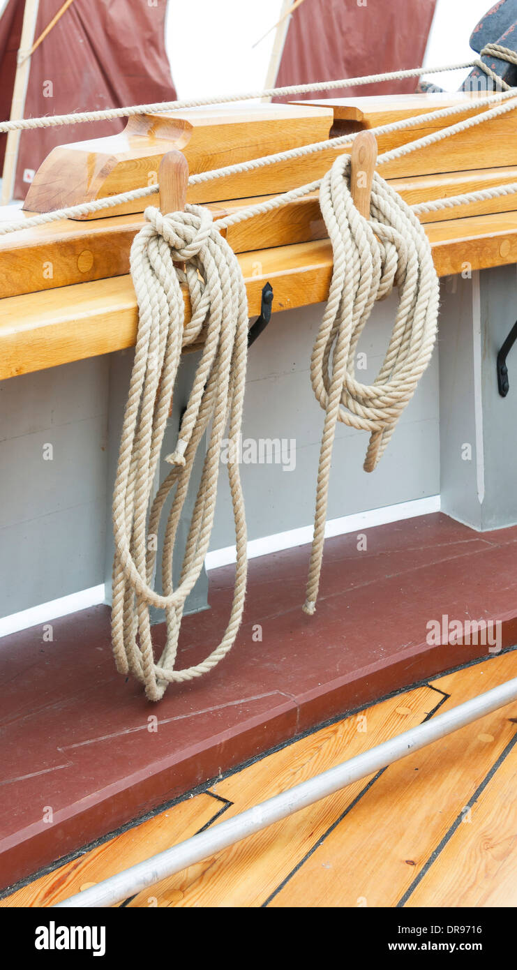 Tightropes tied around wooden peg in a sailing ship Stock Photo - Alamy