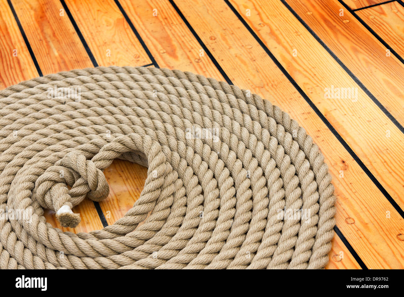 Rope in a spiral shape on ship floor Stock Photo - Alamy