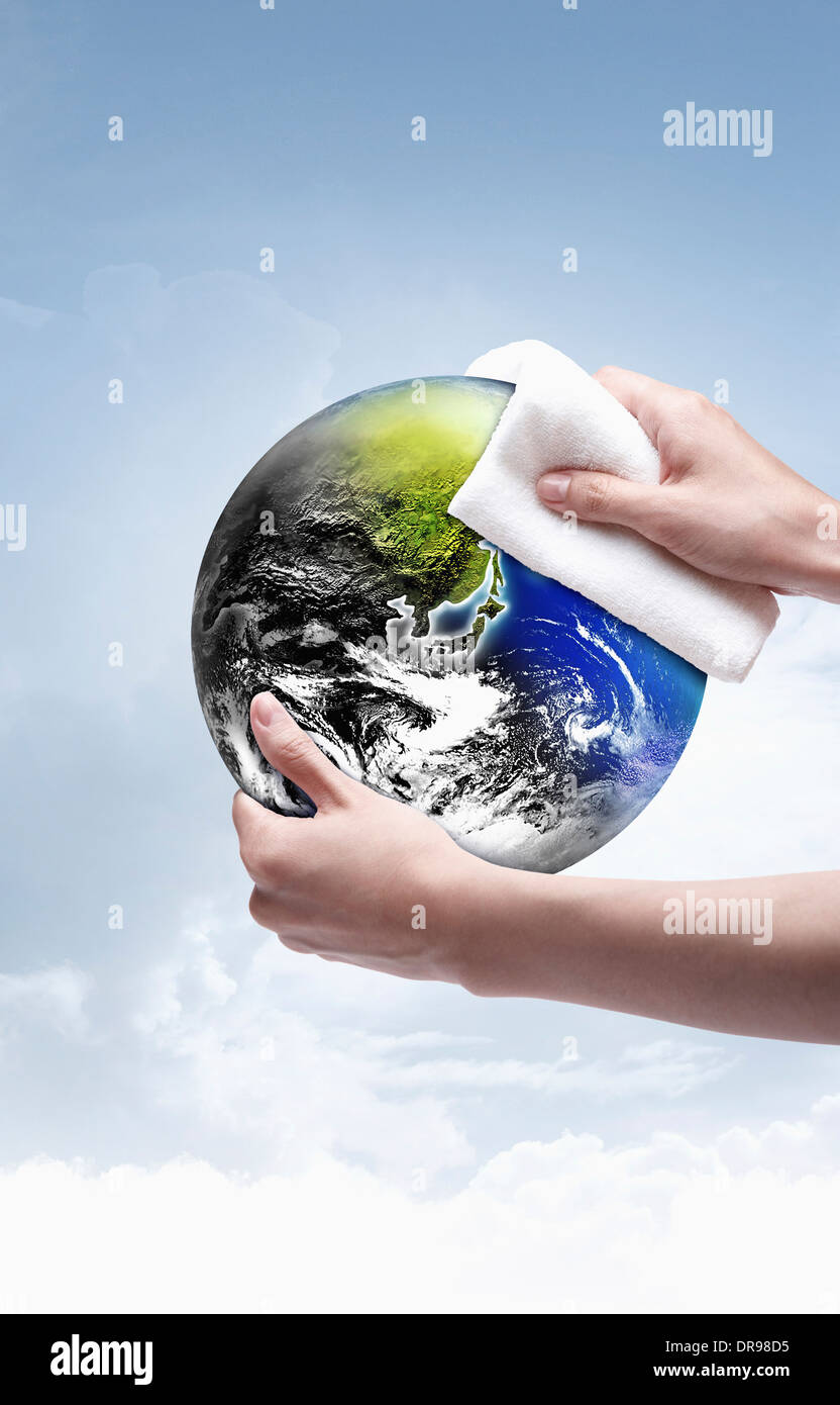 A pair of hands cleaning the globe hi-res stock photography and images ...