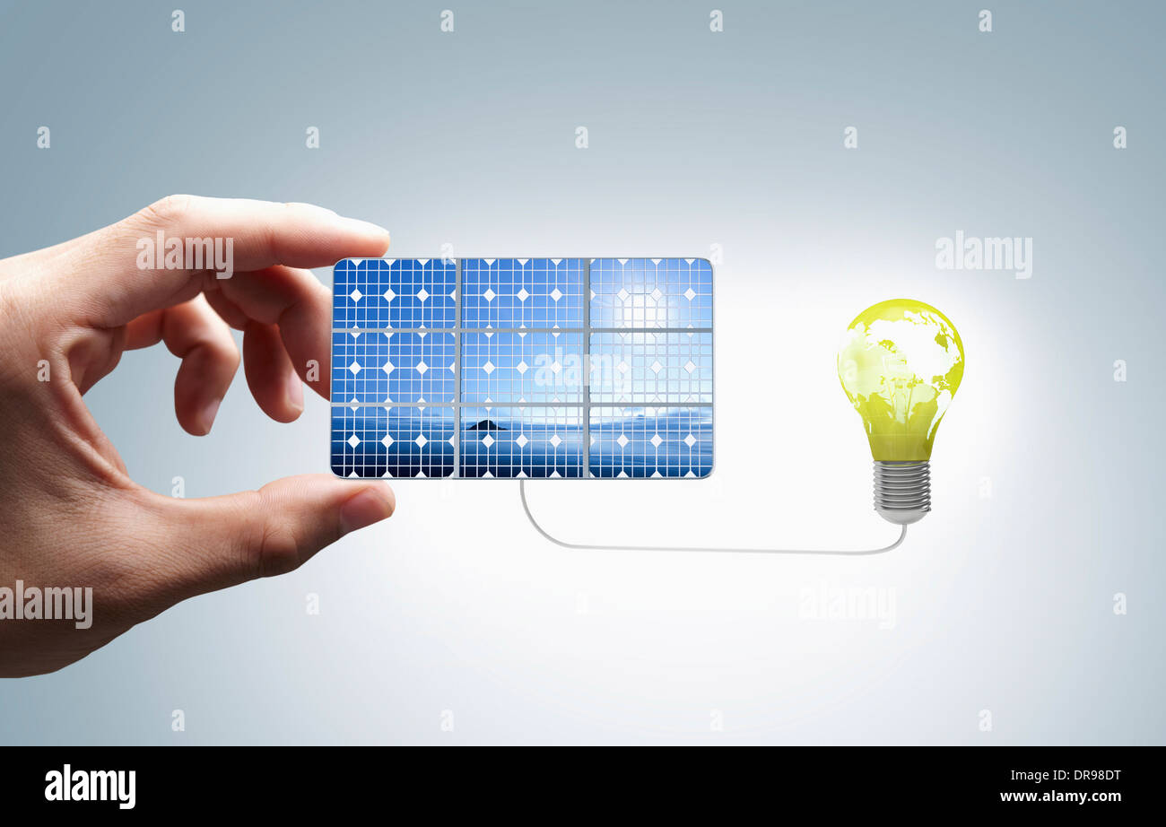 a light bulb powered by a solar panel Stock Photo - Alamy