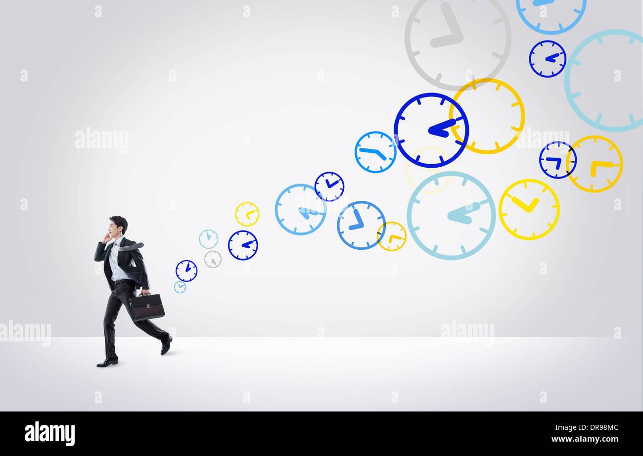 a business man running from illustrated clocks Stock Photo - Alamy