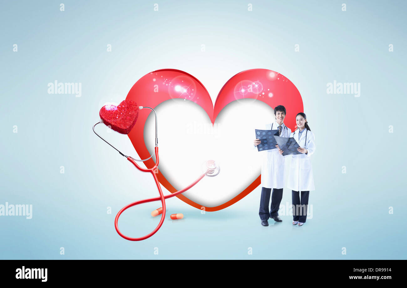 two doctors next to an illustrated heart Stock Photo - Alamy