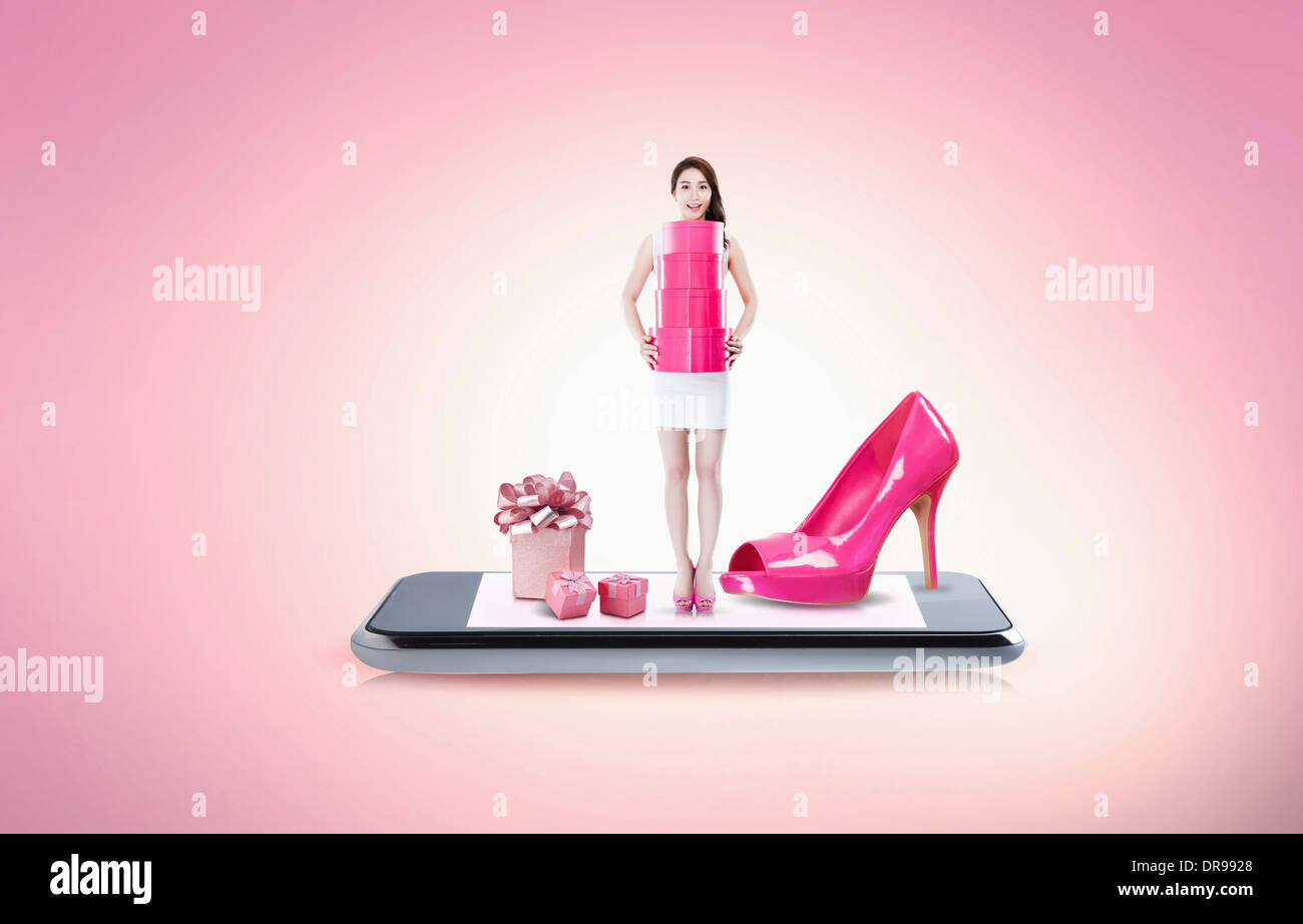 a woman with boxes standing on a smart phone Stock Photo - Alamy
