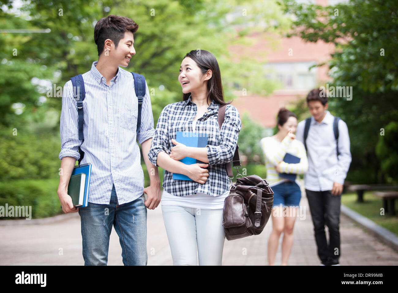 university students walking together in the campus Stock Photo - Alamy