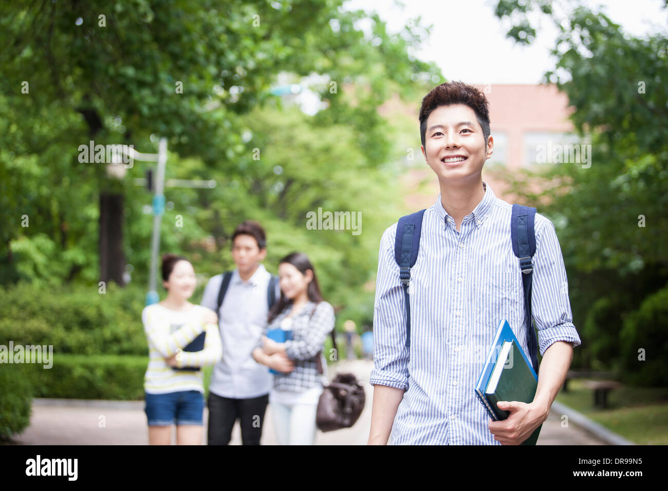 University student standing hi-res stock photography and images - Alamy