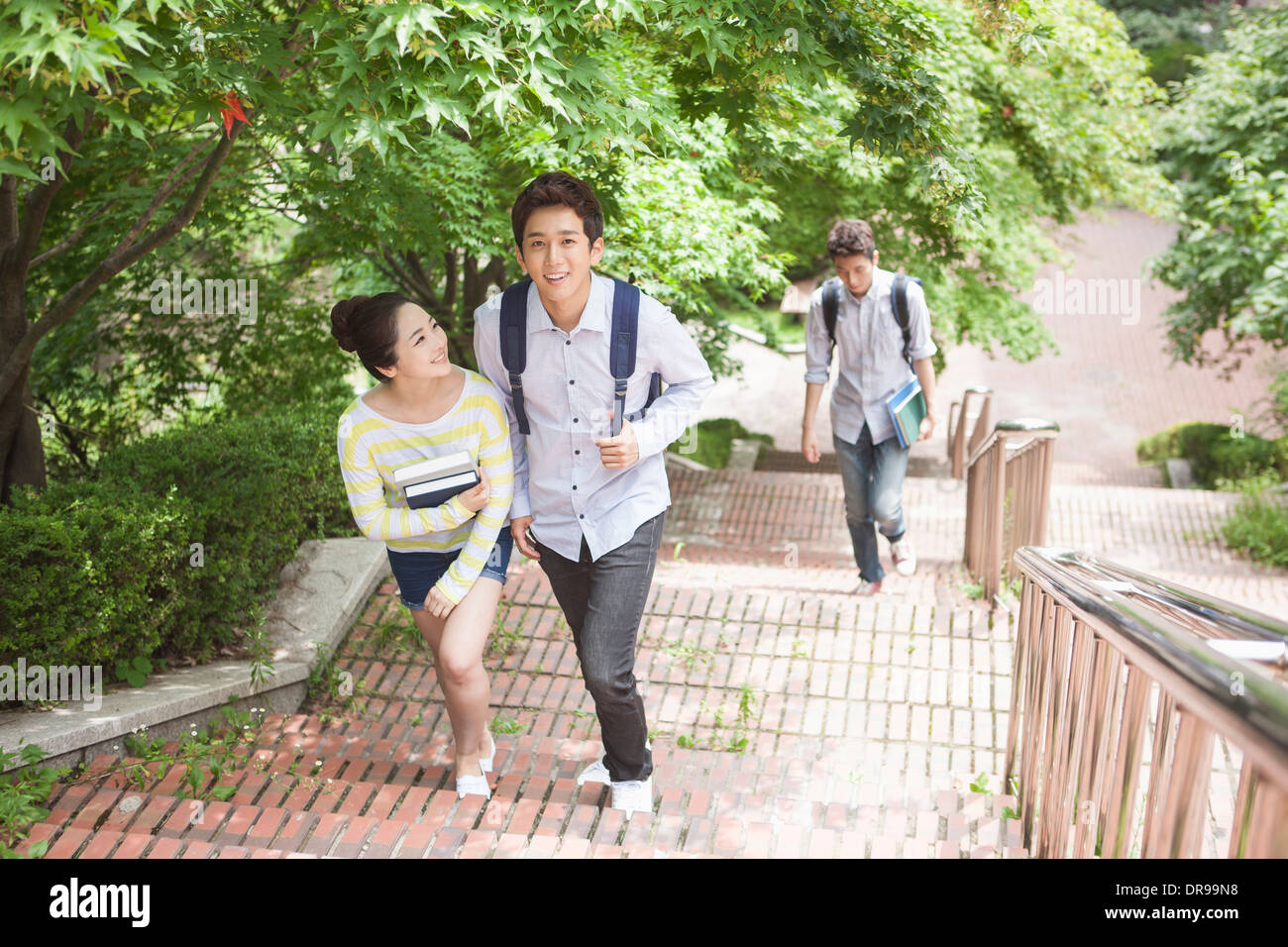 university students walking up the stairs together in the campus Stock ...