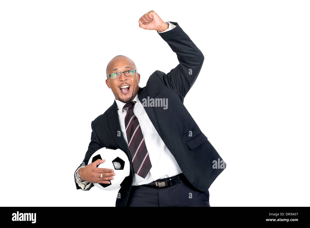 Businessman with soccer ball celebrating a goal, isolated in white ...